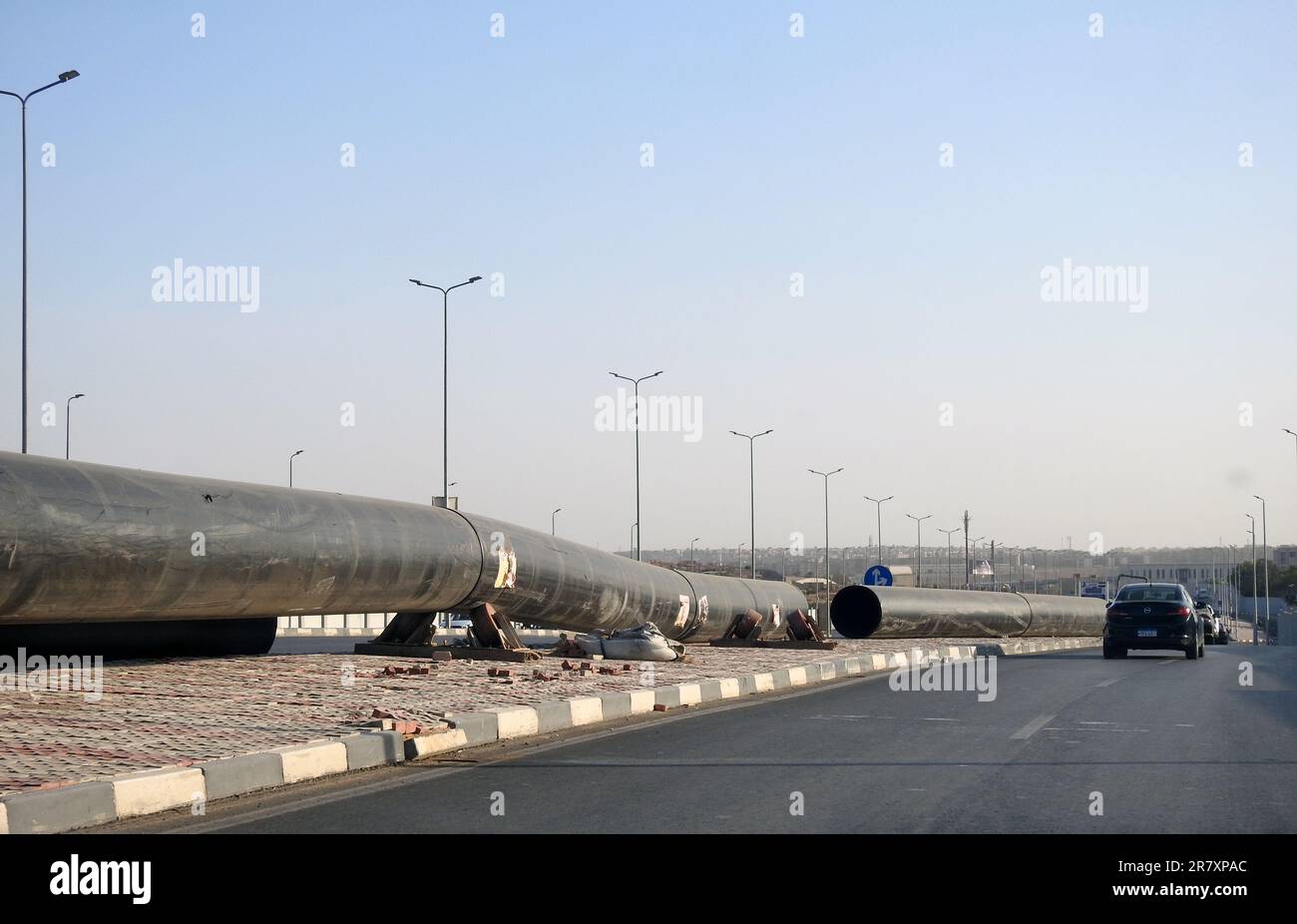 Cairo, Egypt, May 22 2023: preparations to place large water pipe parts ...