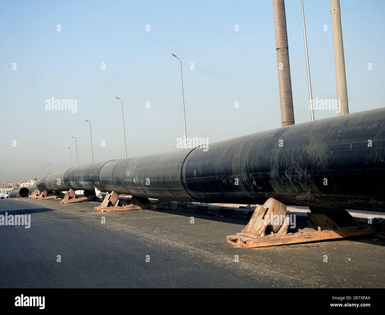 Cairo, Egypt, May 23 2023: preparations to place large water pipe parts ...