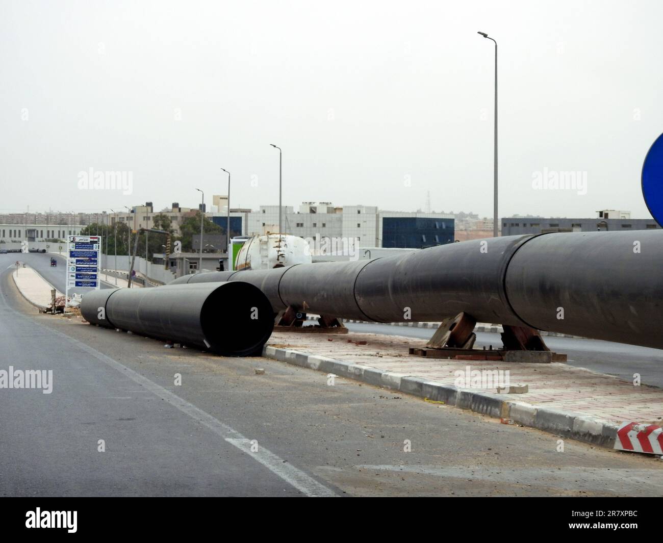 Cairo, Egypt, May 26 2023: preparations to place large water pipe parts ...