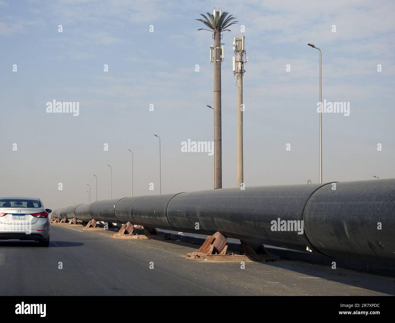 Cairo, Egypt, May 31 2023: preparations to place large water pipe parts ...