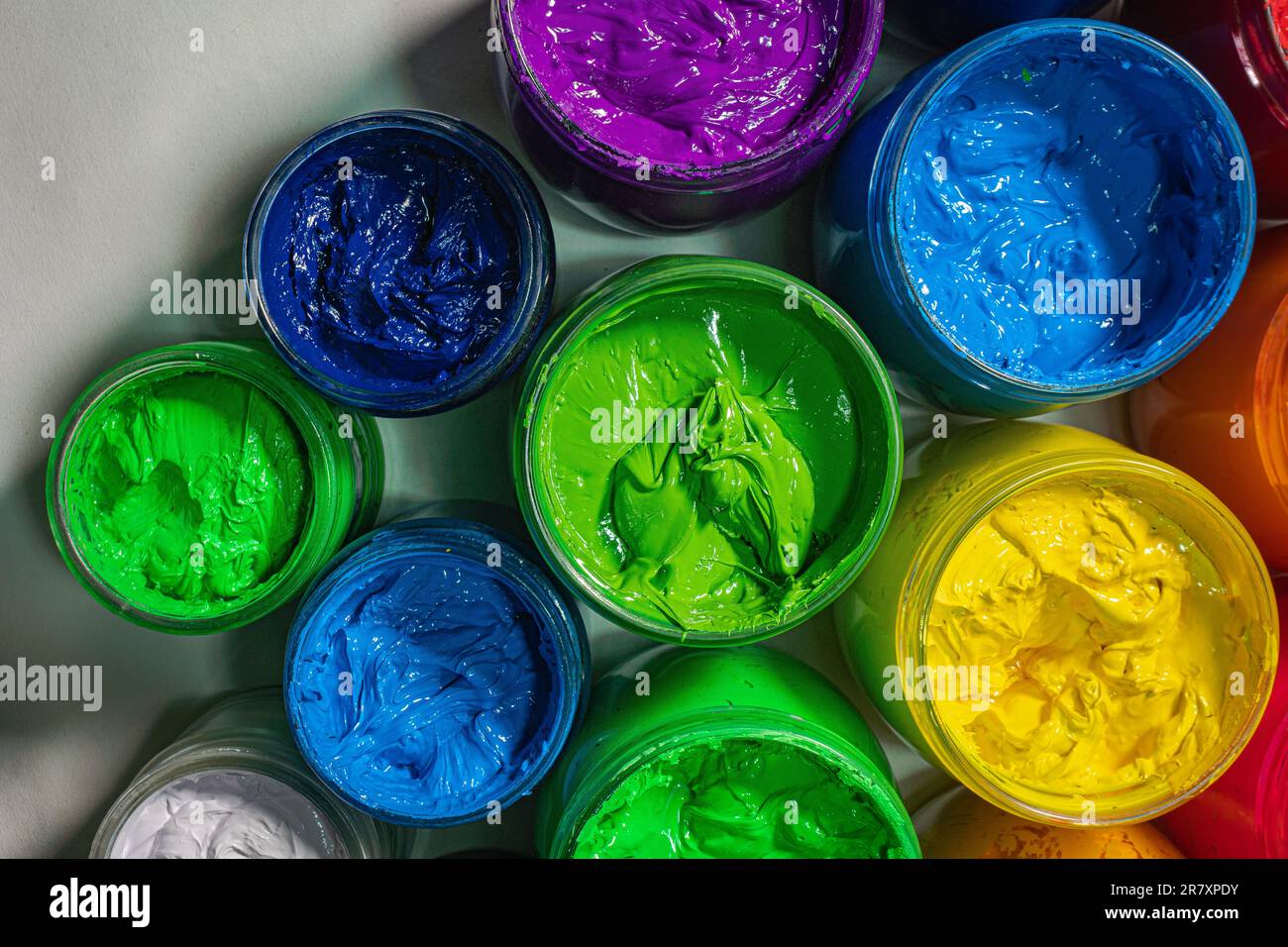 Top view various colors for shirt printing packed in glass bottles ...