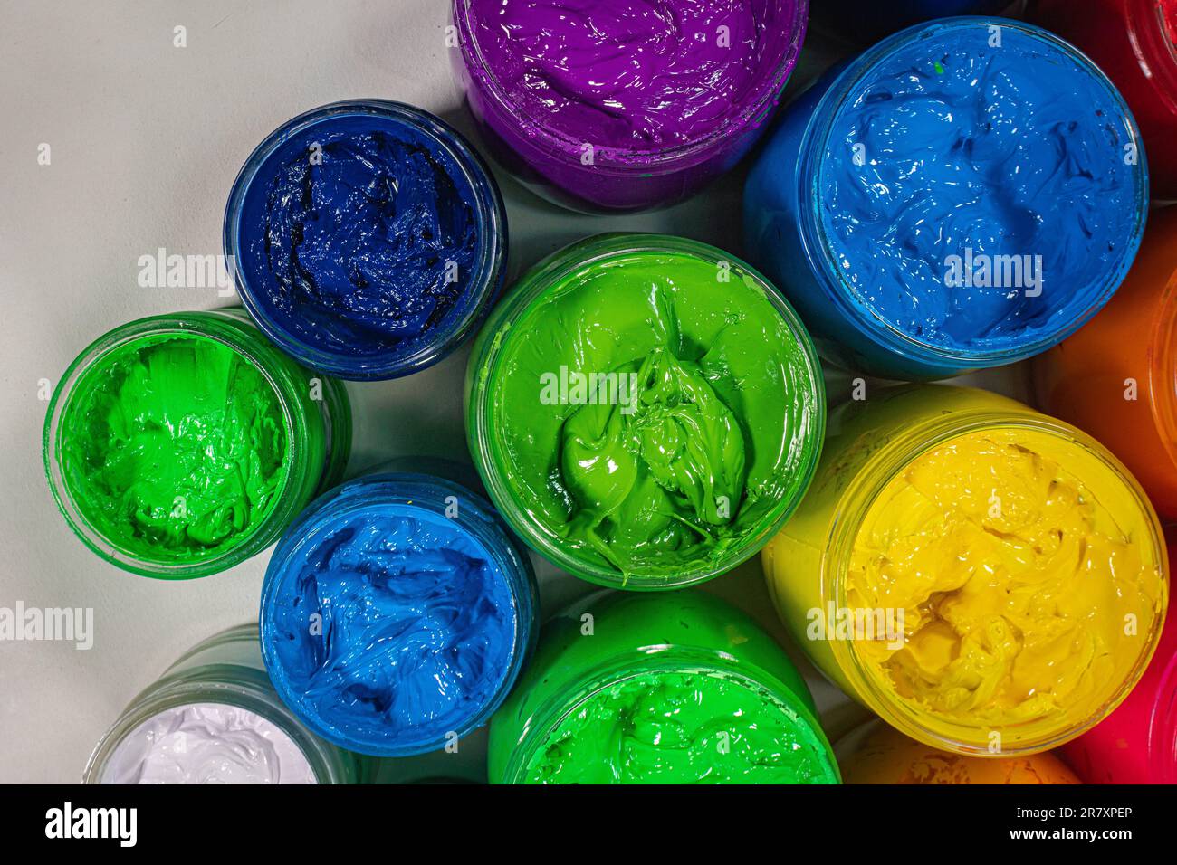 Top view various colors for shirt printing packed in glass bottles ...