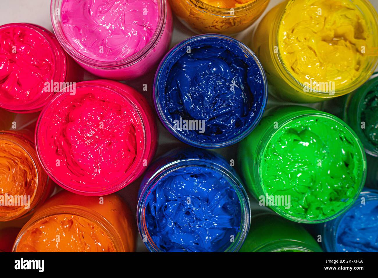 Top view various colors for shirt printing packed in glass bottles ...