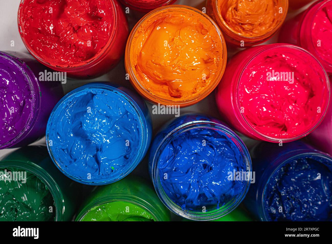 Top view various colors for shirt printing packed in glass bottles ...