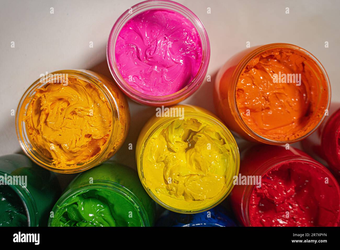 Top view various colors for shirt printing packed in glass bottles ...