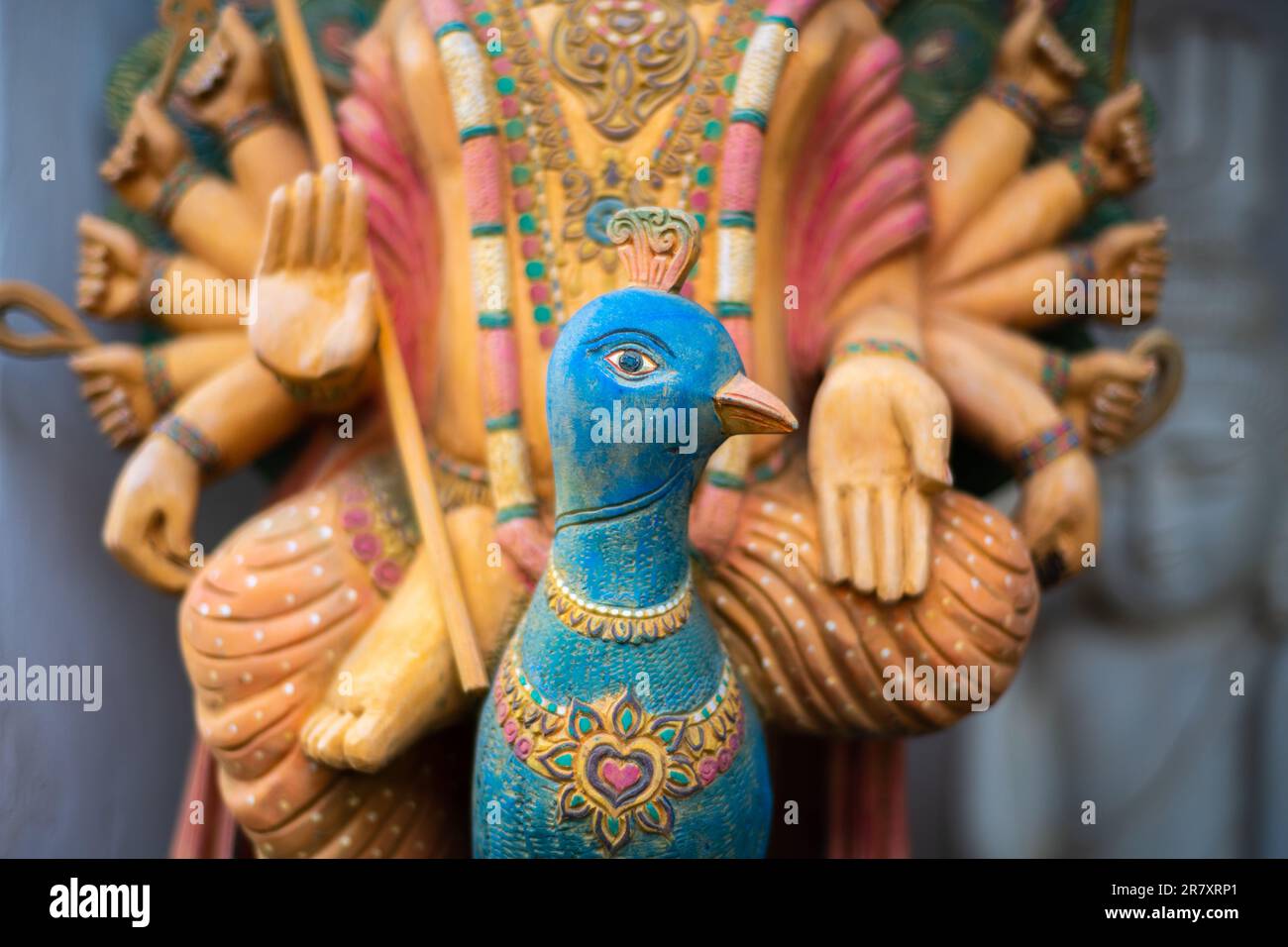 Wooden statue of Hindu god Murugan riding a peacock Stock Photo - Alamy