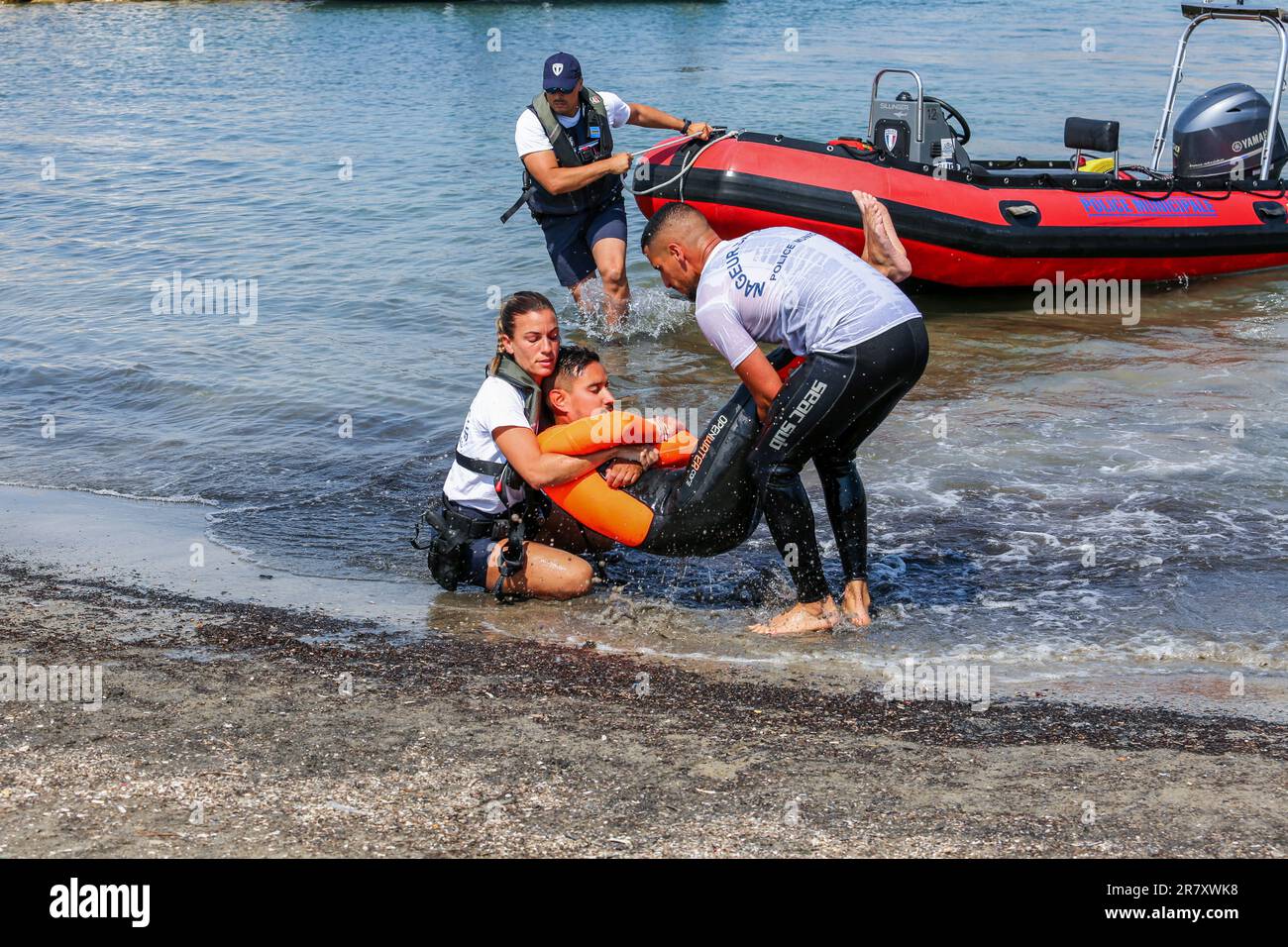 Police officers from the maritime brigade of the municipal police carry ...