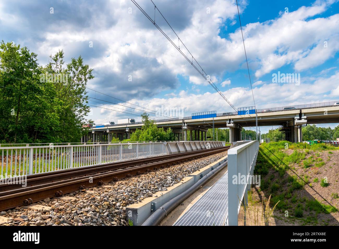 Intersection of the railway line with the motorway. Car bridge in the ...