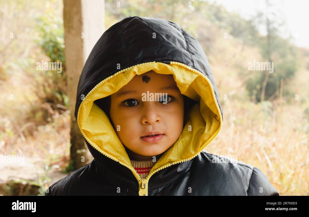 Cute baby wearing baby hood smiling and looking at camera. Cute baby ...