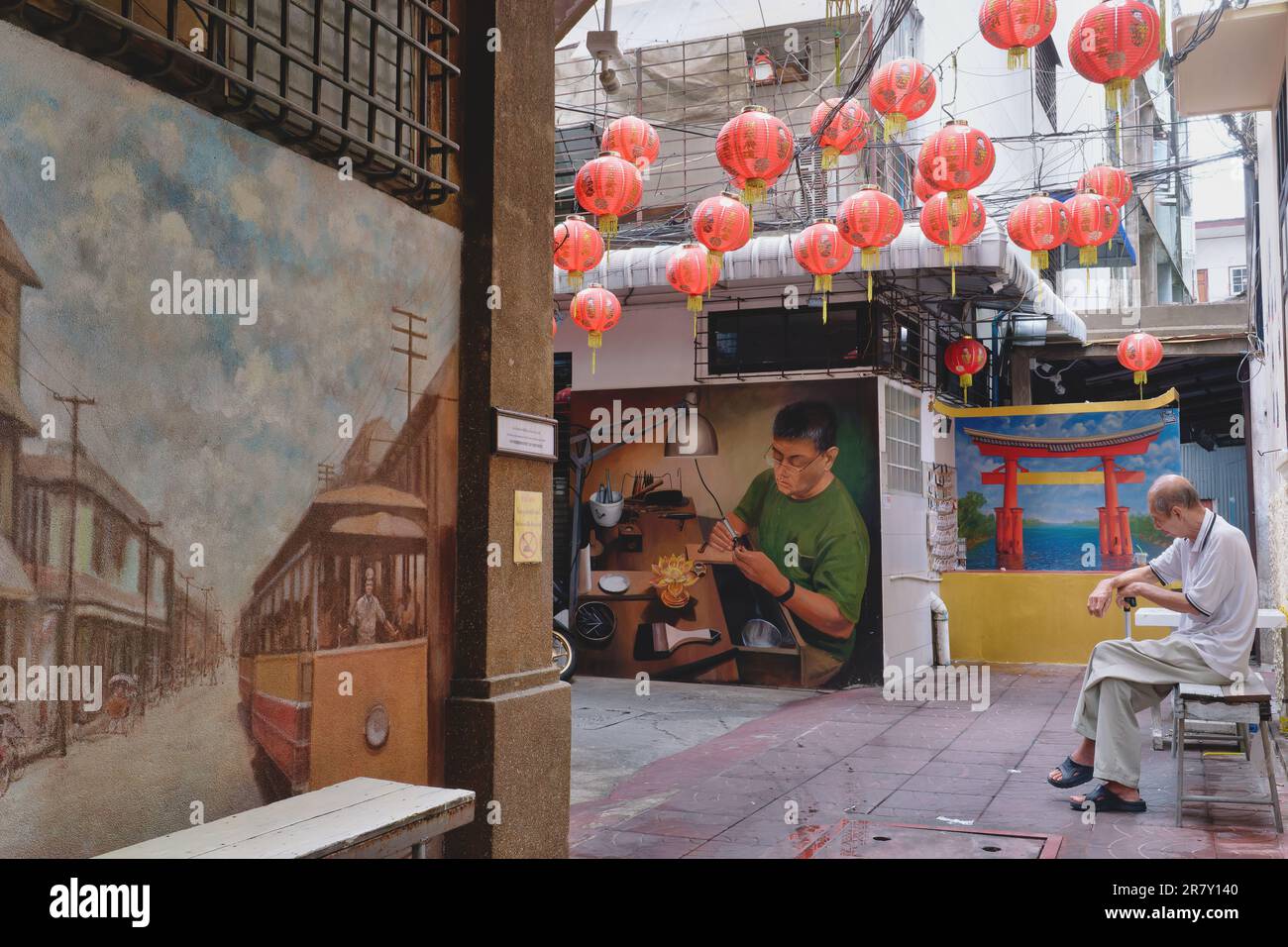 Murals in a lane in Chinatown, Bangkok, Thailand, depicting a craftsman ...