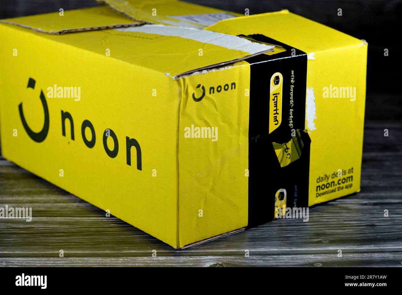 Cairo, Egypt, June 12 2023: Noon online shopping delivery yellow box ...