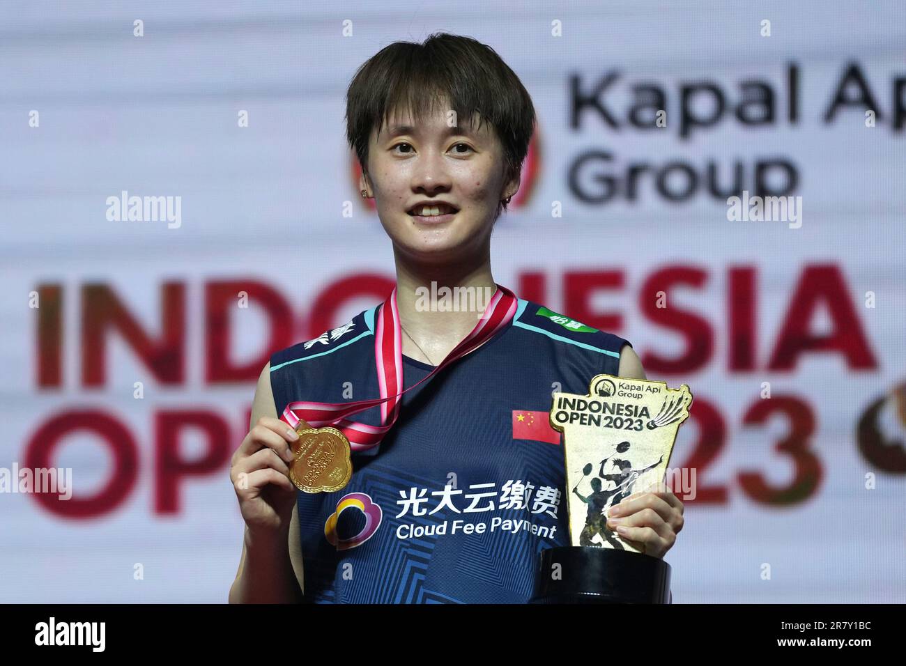 China's Chen Yu Fei celebrates on the podium with her trophy and gold ...