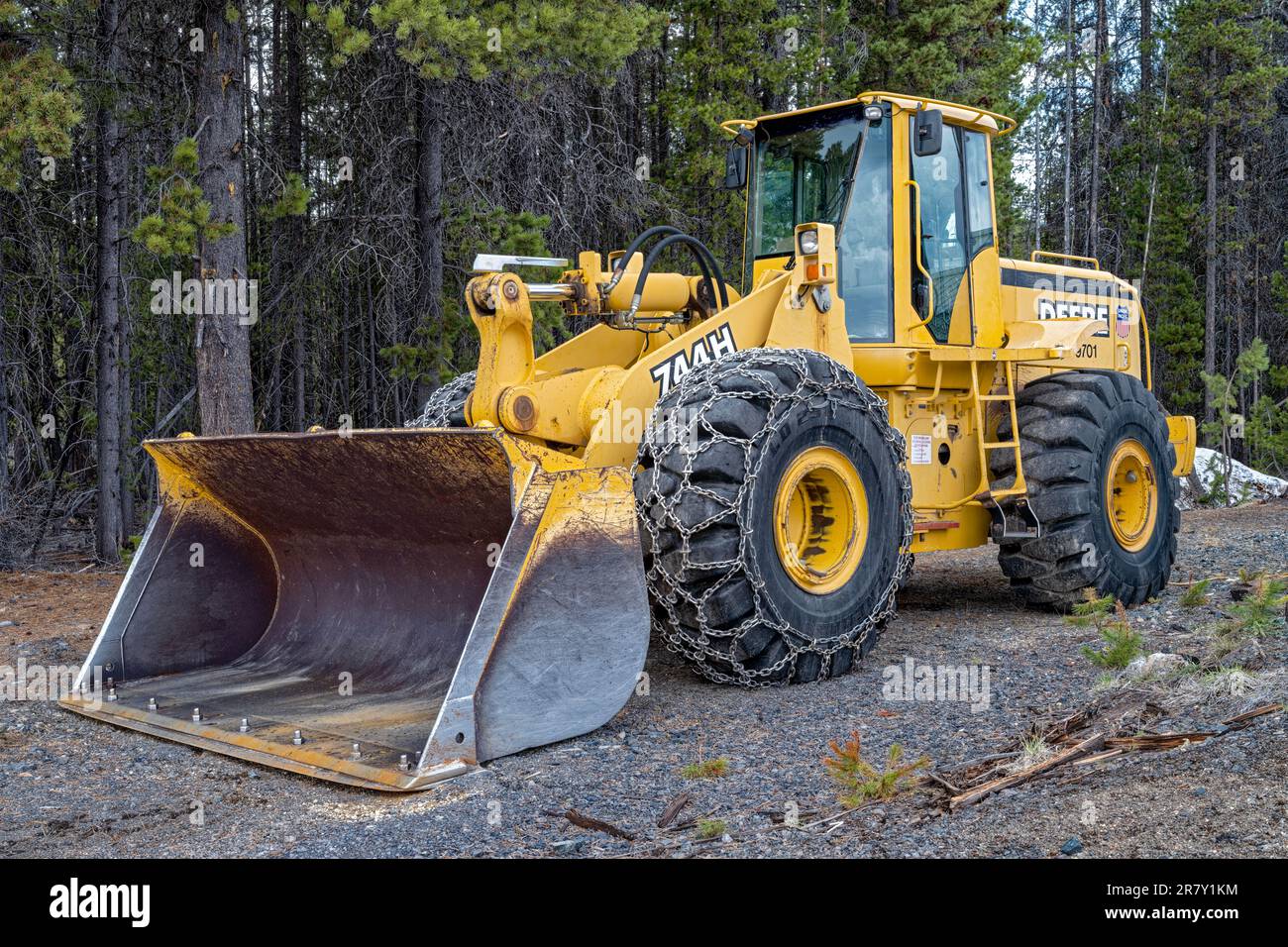 A parked John Deere 744h wheel loader with tire chains in Crescent Lake ...