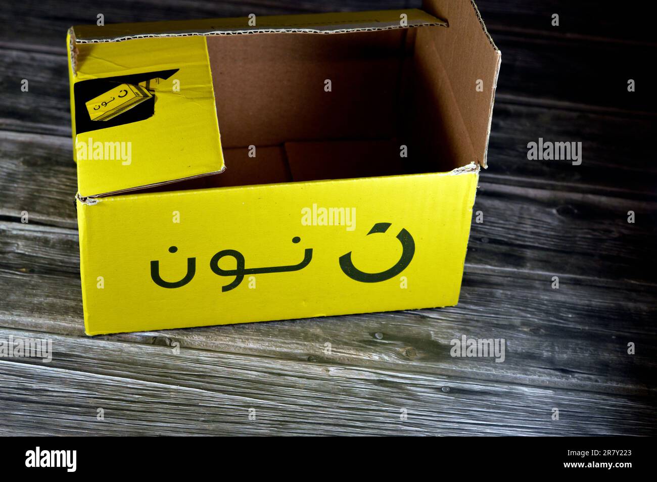 Cairo, Egypt, June 12 2023: Noon online shopping delivery yellow box ...