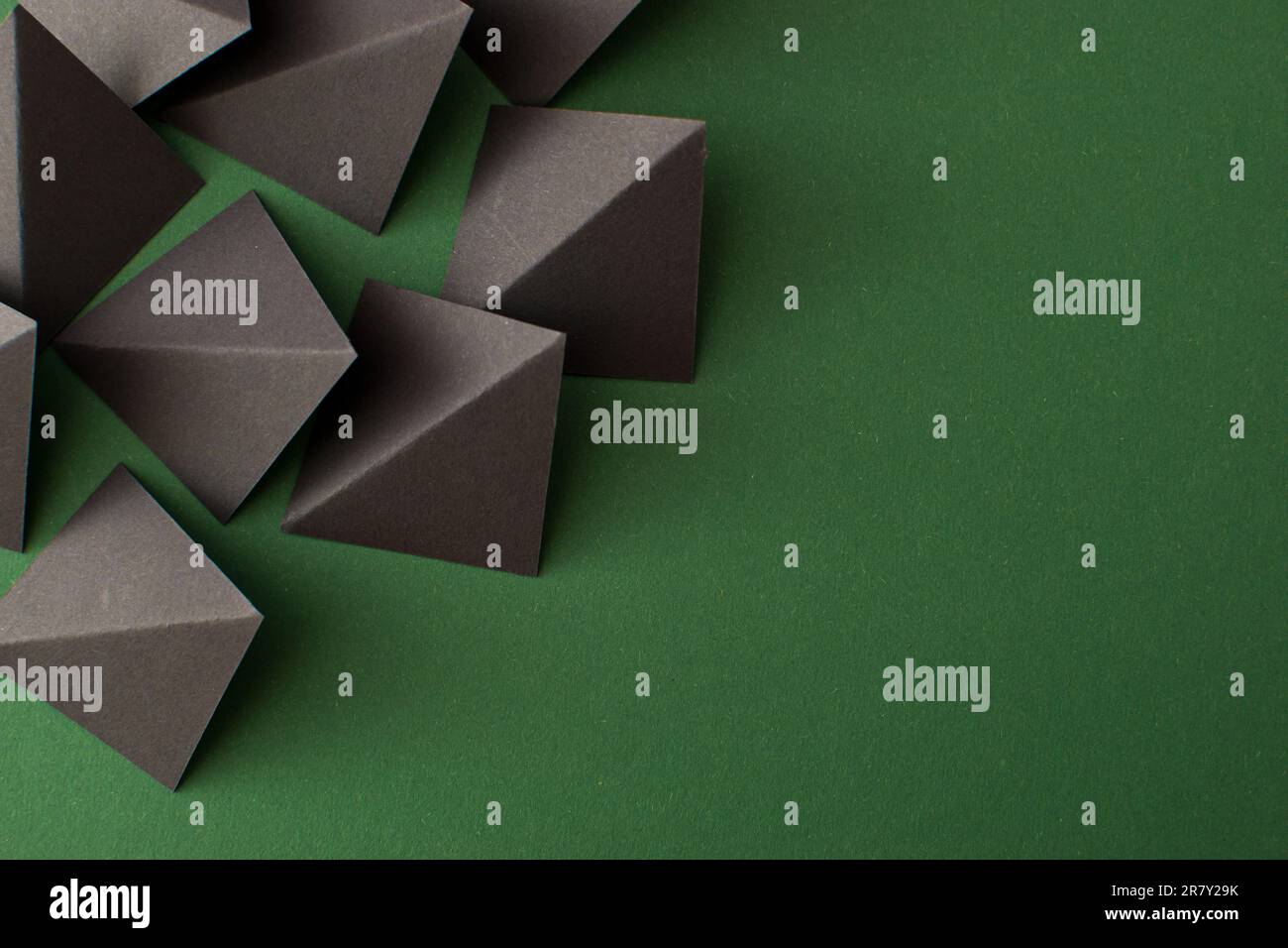 Black 3d triangle shapes on green background, copy space Stock Photo ...