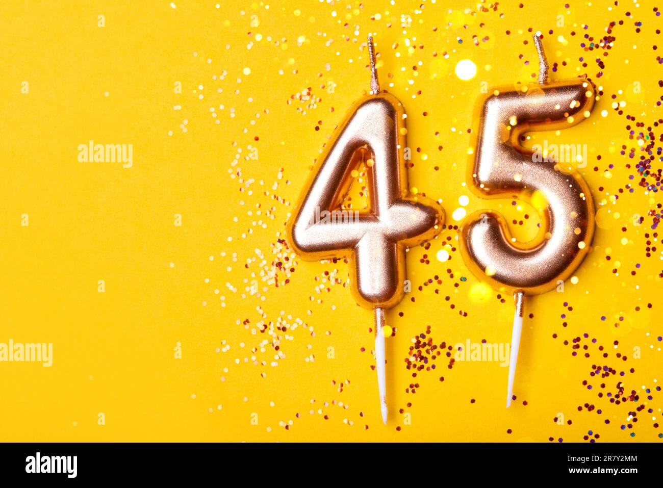 45 years celebration. Greeting banner. Gold candles in the form of ...