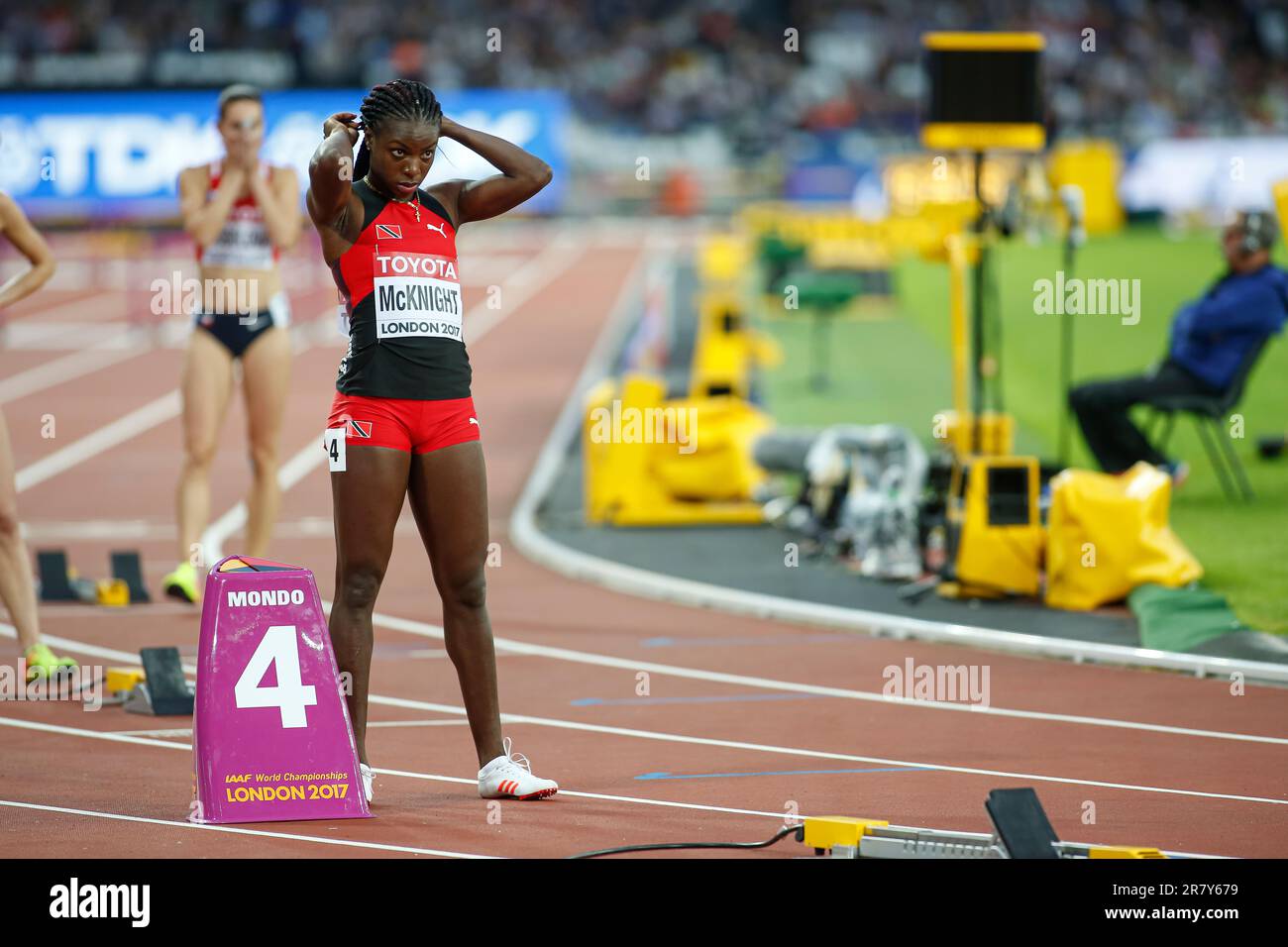 Sparkle McKnight participating in the 400 meters hurdles at the World ...