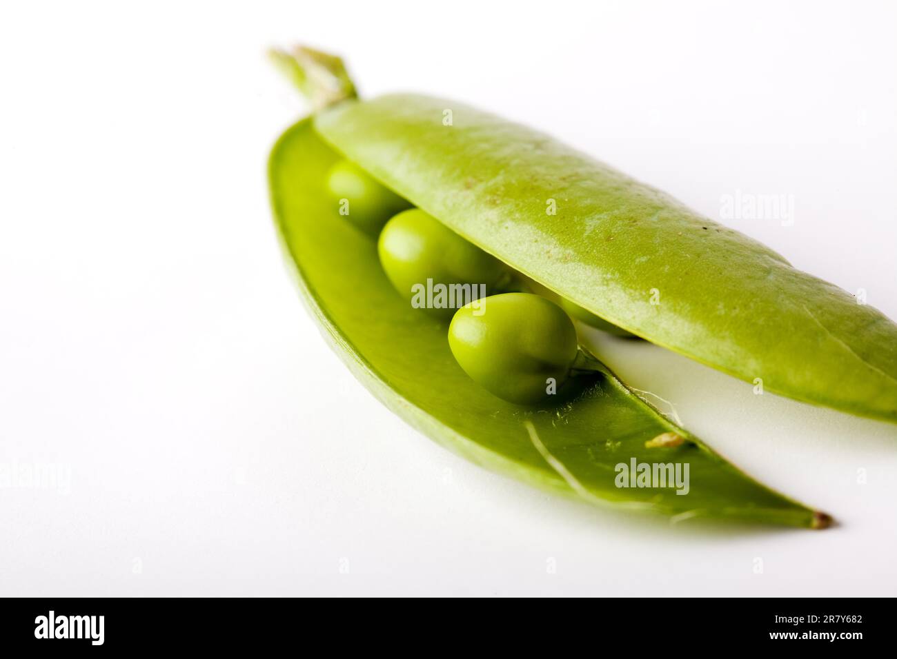 Fresh pea pods with a white background Stock Photo - Alamy