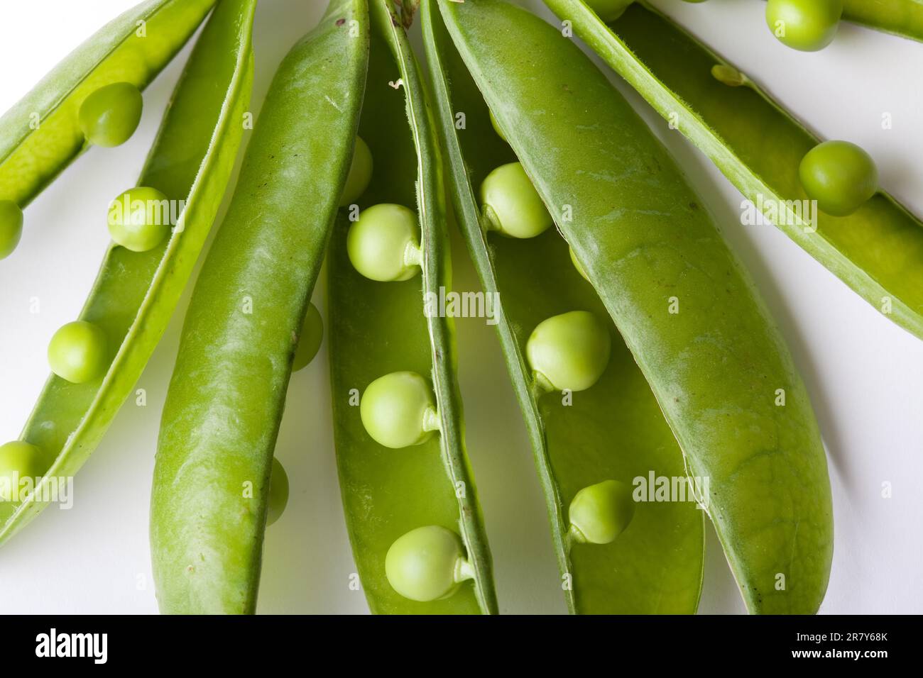 Fresh pea pods with a white background Stock Photo - Alamy