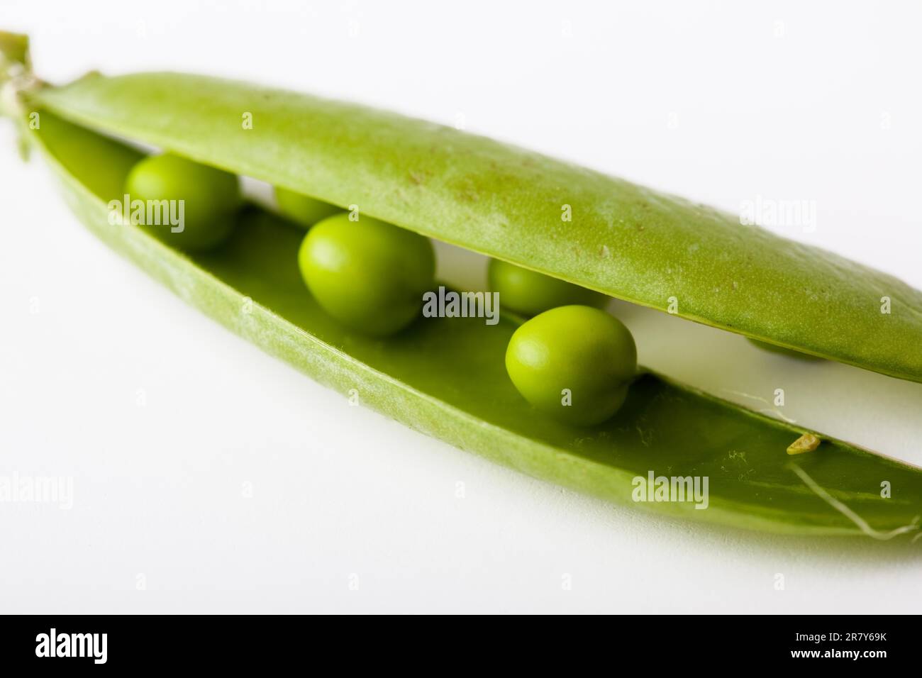 Fresh pea pods with a white background Stock Photo - Alamy