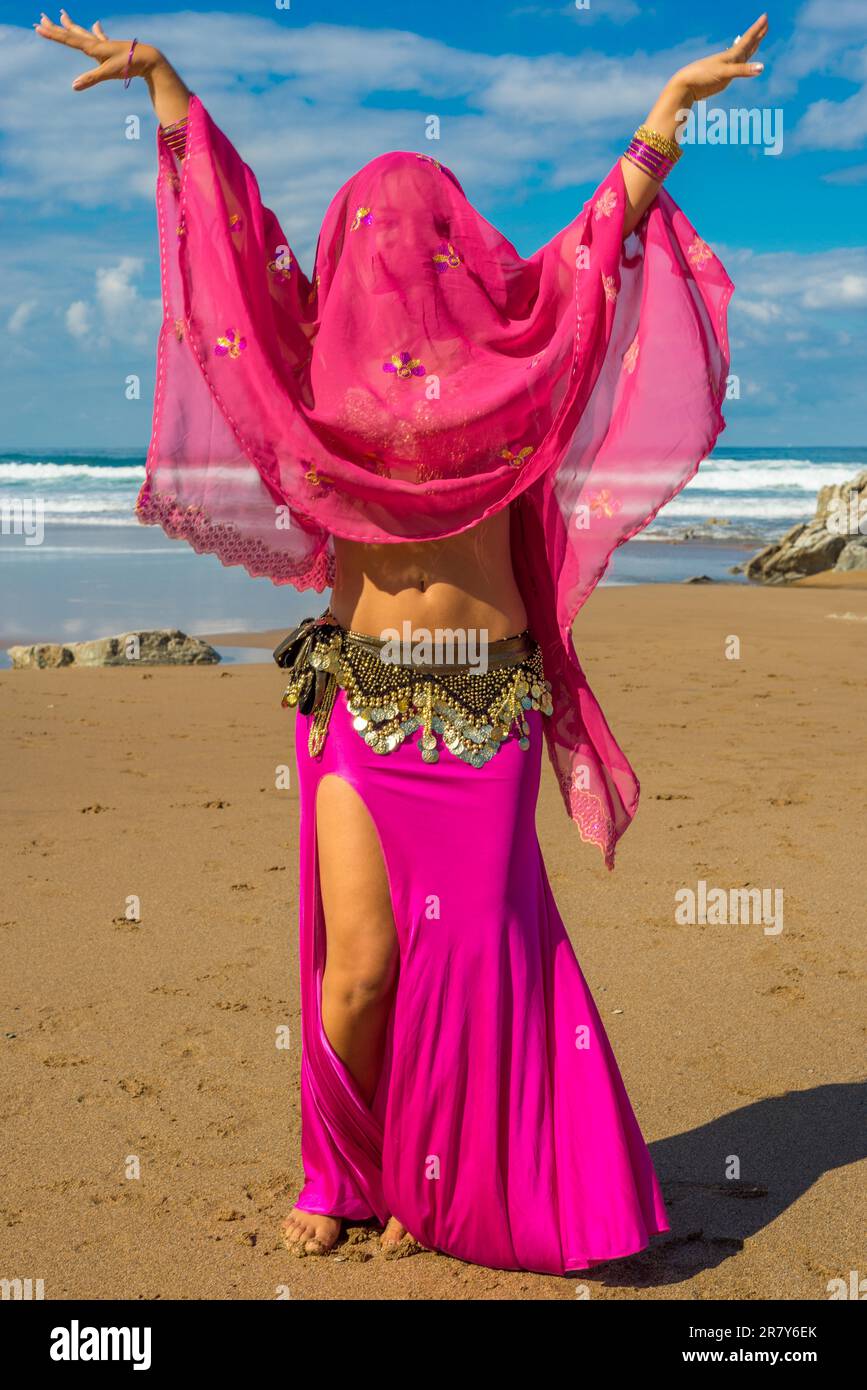 Veiled belly dancer north of Bilbao on the beach of Sopelana on the Bay of Biscay Stock Photo ...