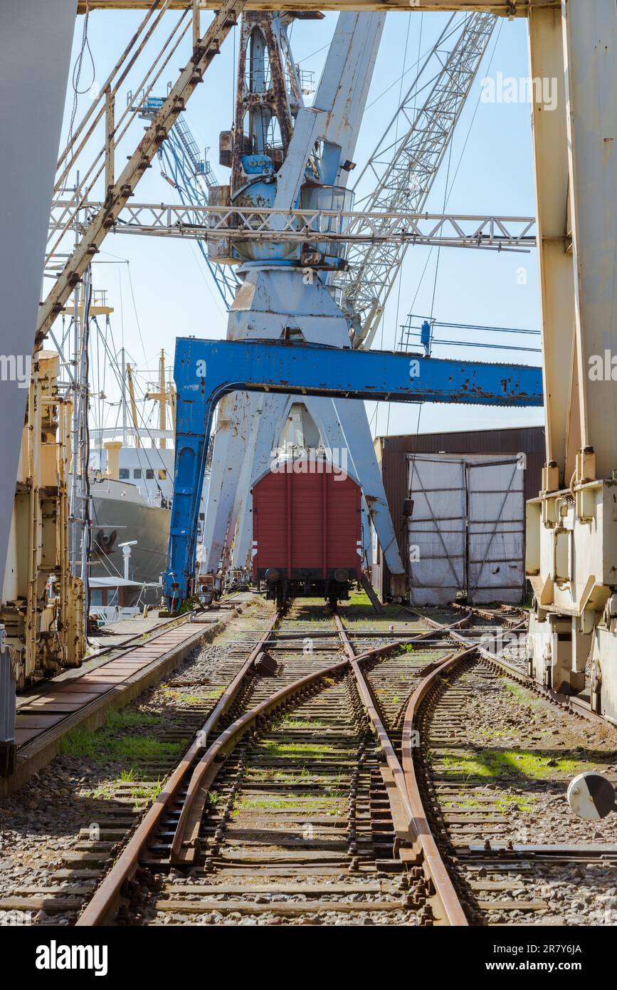 Historical harbor cranes and railway carriage at the Port Museum at ...