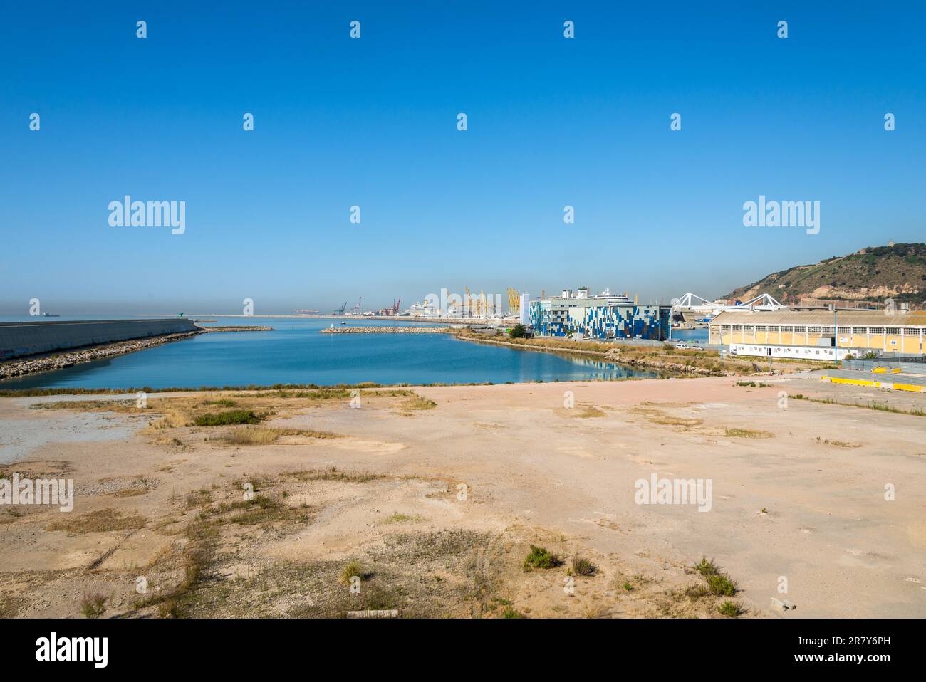 In the foreground an old harbor basin and the cruise port of Barcelona ...