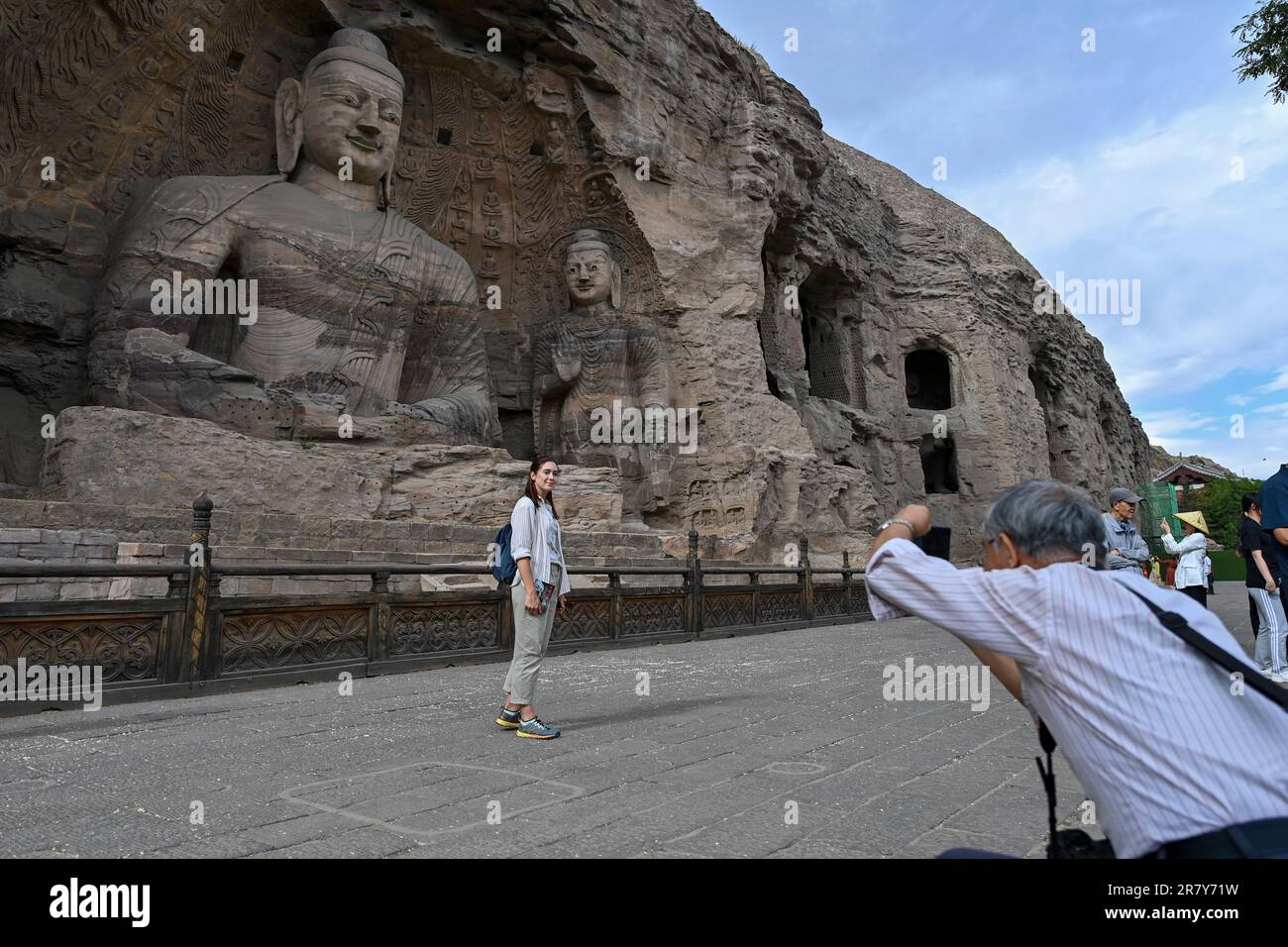 Datong, China's Shanxi Province. 7th June, 2023. A visitor poses for ...
