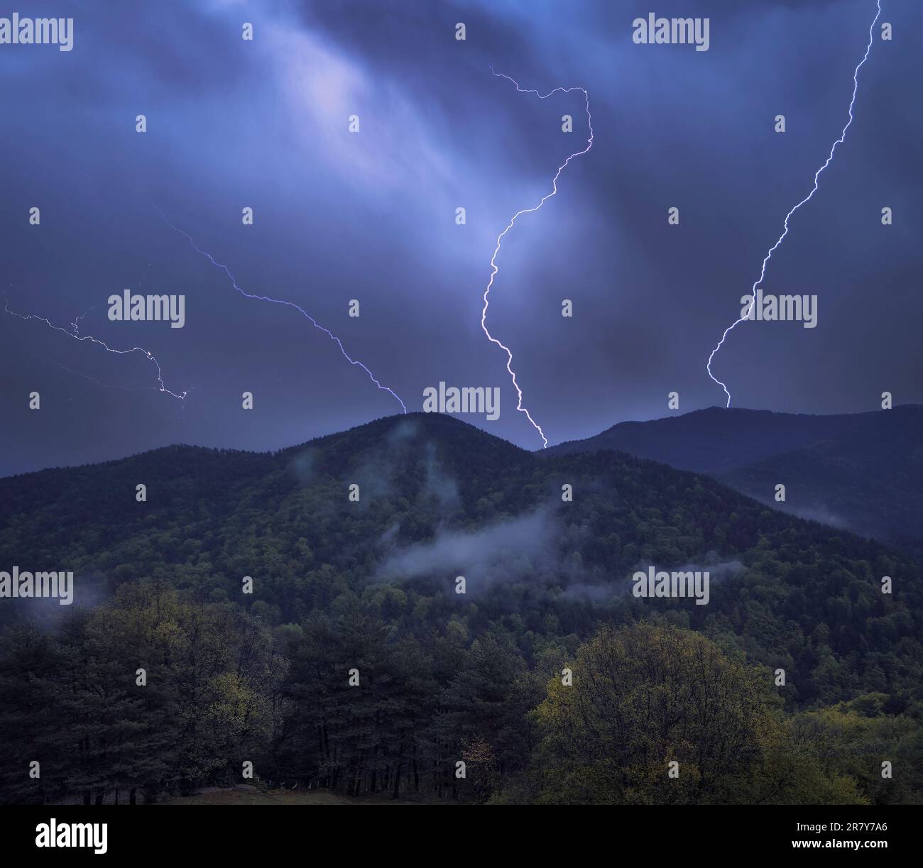 Dramatic storm clouds illuminated by intense lightning strikes Stock ...