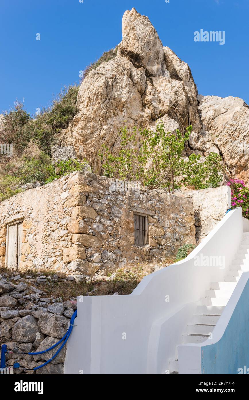 Old stone shed at the hillside in Paleochora on Crete. The rock looks ...