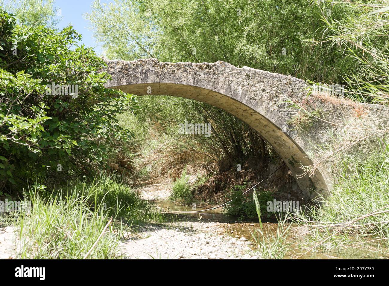 Old stone arch bridge on an old road in the southern foothills of the ...
