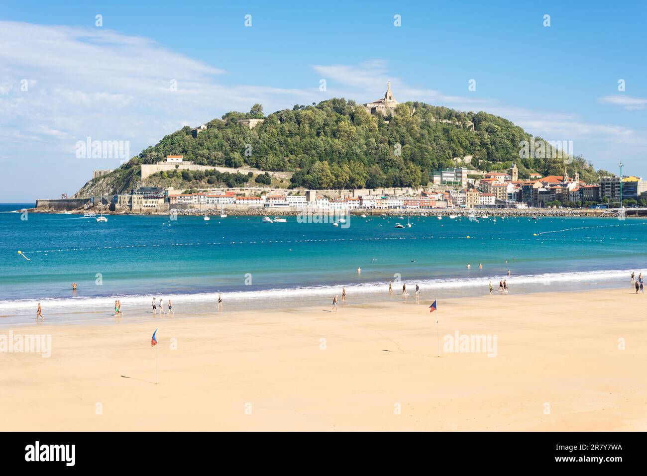 View to the mountain Urgull with the sculpture of Jesus. At the beach ...
