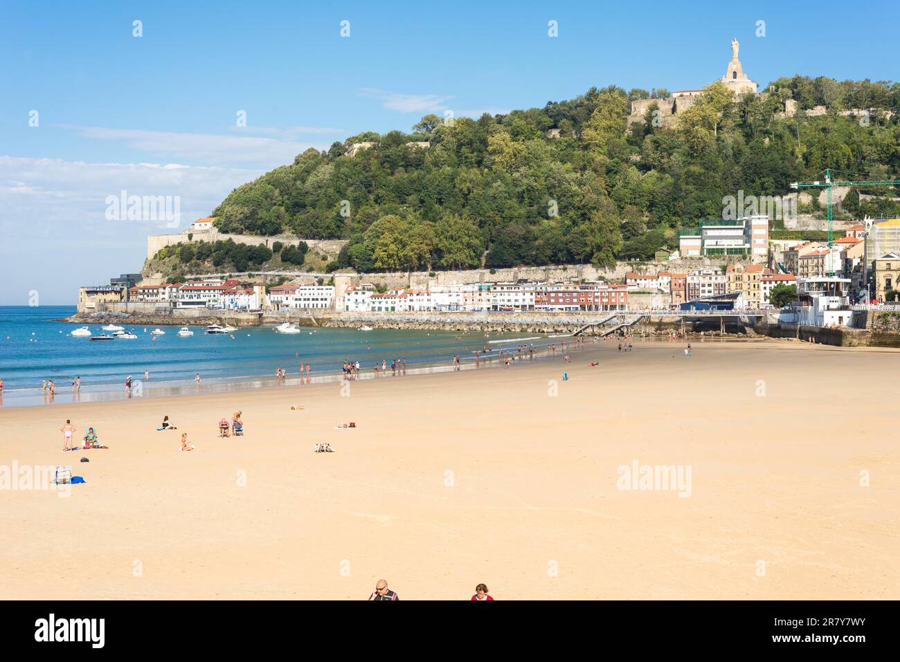 View to the mountain Urgull with the sculpture of Jesus. The beach of ...