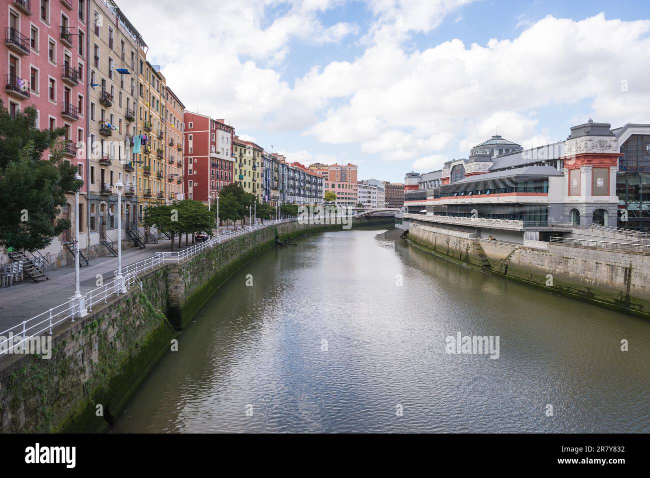 House facades in Bilbao along the Nervion river that runs through the ...
