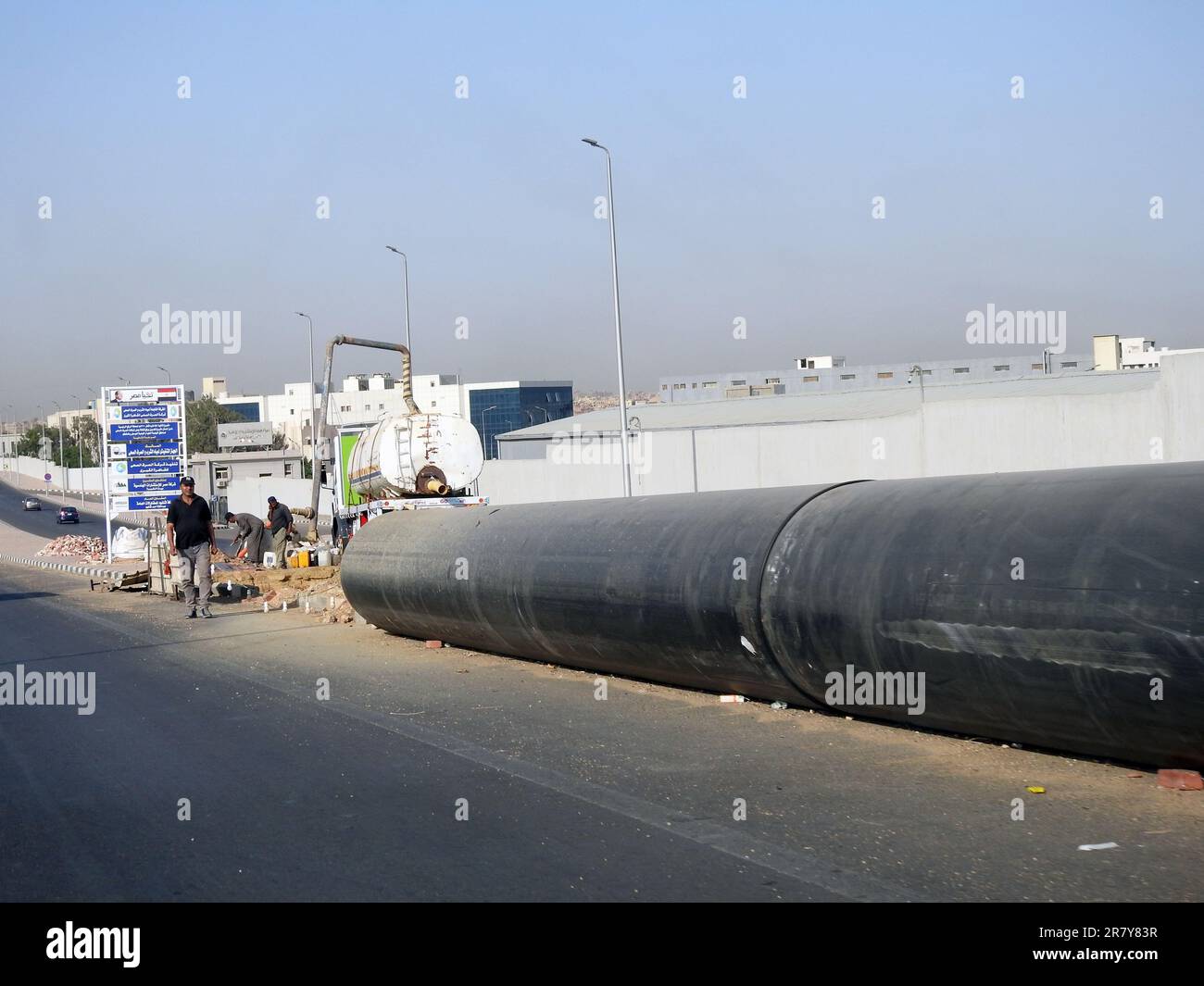 Cairo, Egypt, May 23 2023: preparations to place large water pipe parts ...