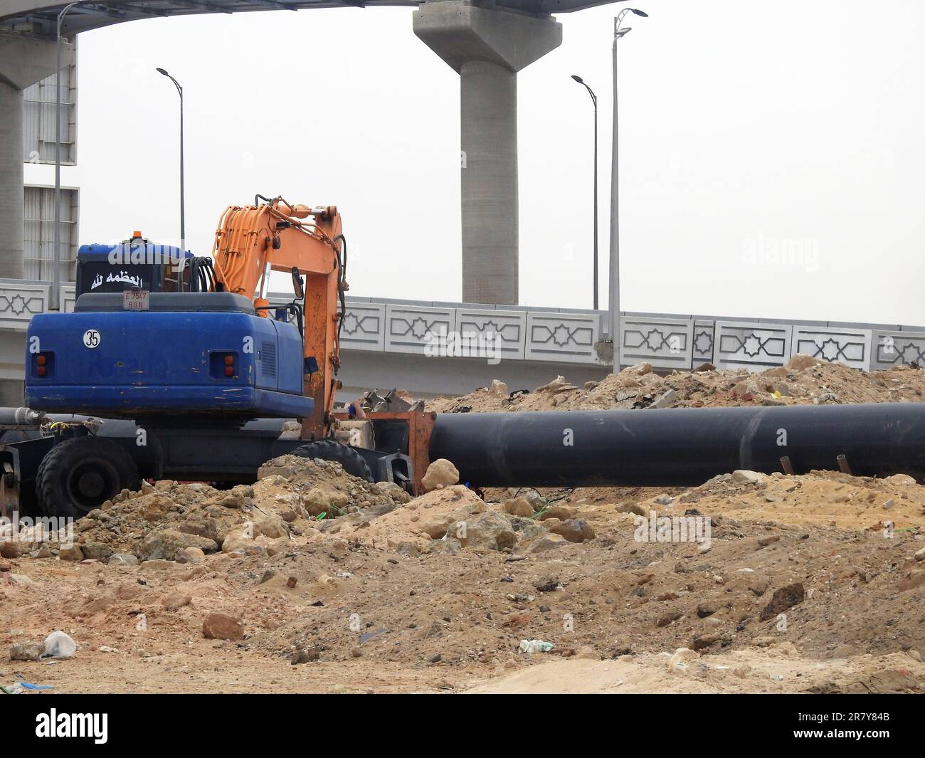Cairo, Egypt, May 26 2023: preparations to place large water pipe parts ...