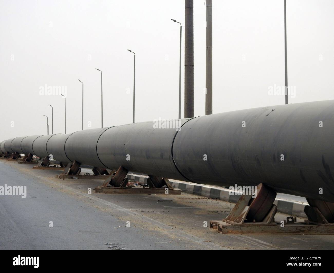 Cairo, Egypt, May 26 2023: preparations to place large water pipe parts ...