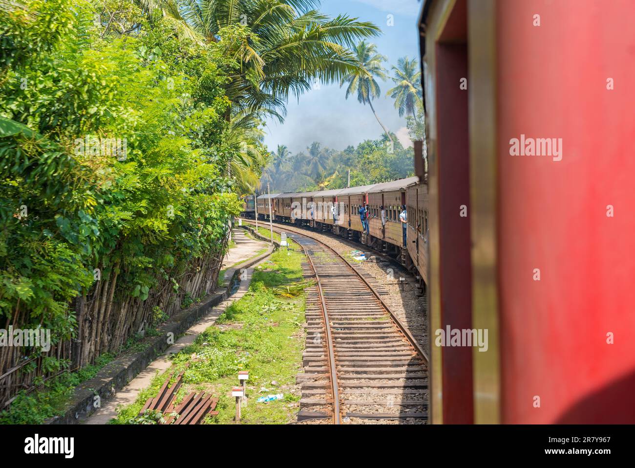 In the railroad car on the way to Colombo. Local people in and outside ...