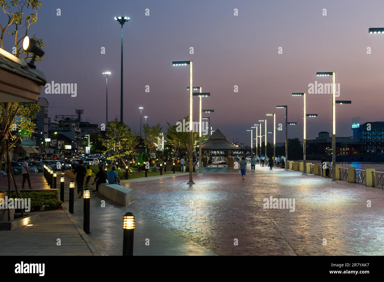 People, locals and tourists stroll and relax on the promenade of the ...