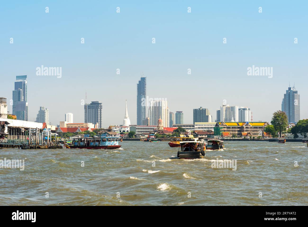 Ships and boats on the Chao Phraya, a major river in Thailand. The ...