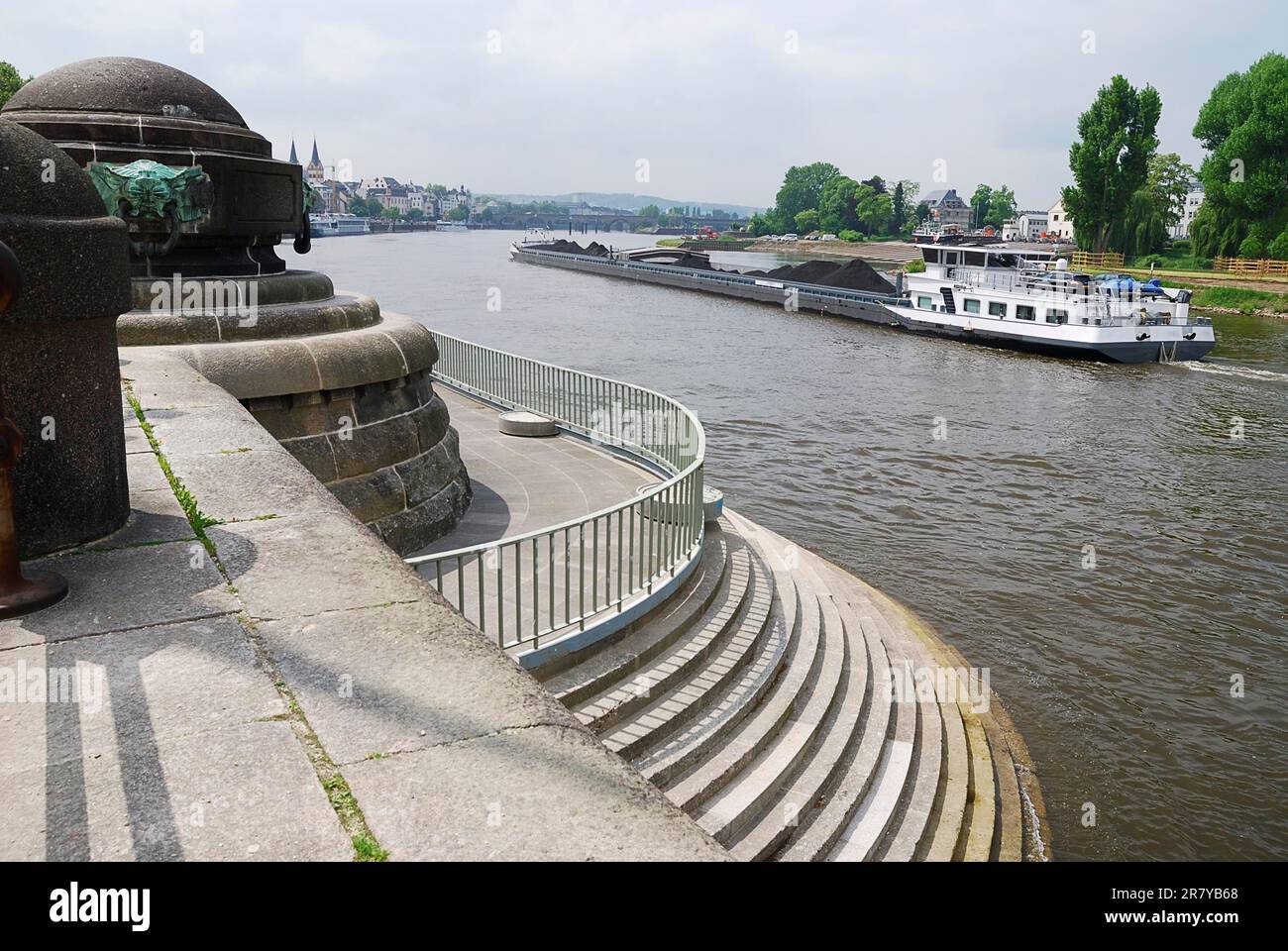 Transport ship on the river Rhine passing the headland Deutsches Eck ...