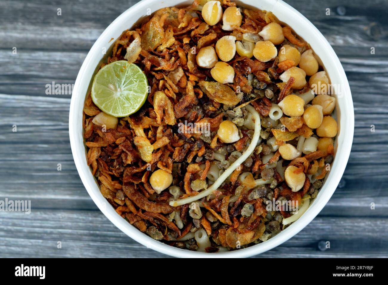 Egyptian cuisine of Koshary, a popular street food made of rice ...