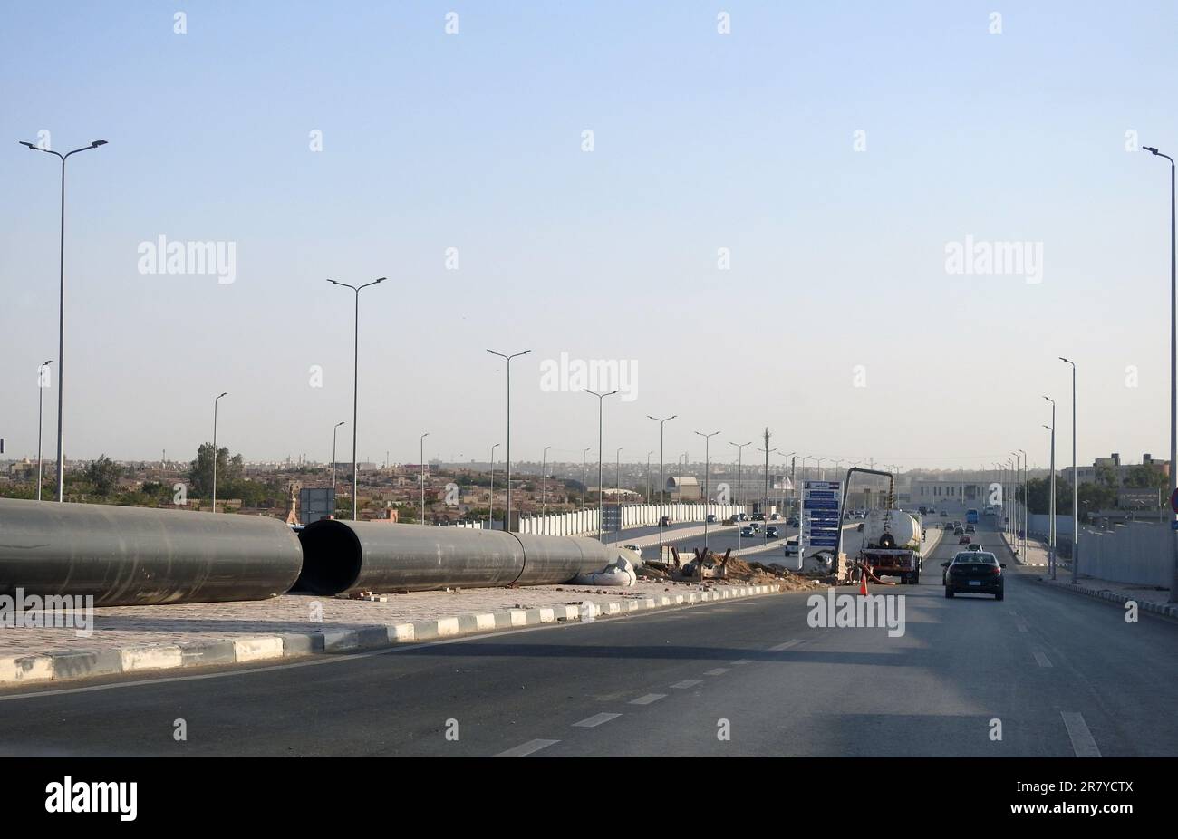 Cairo, Egypt, May 22 2023: preparations to place large water pipe parts ...