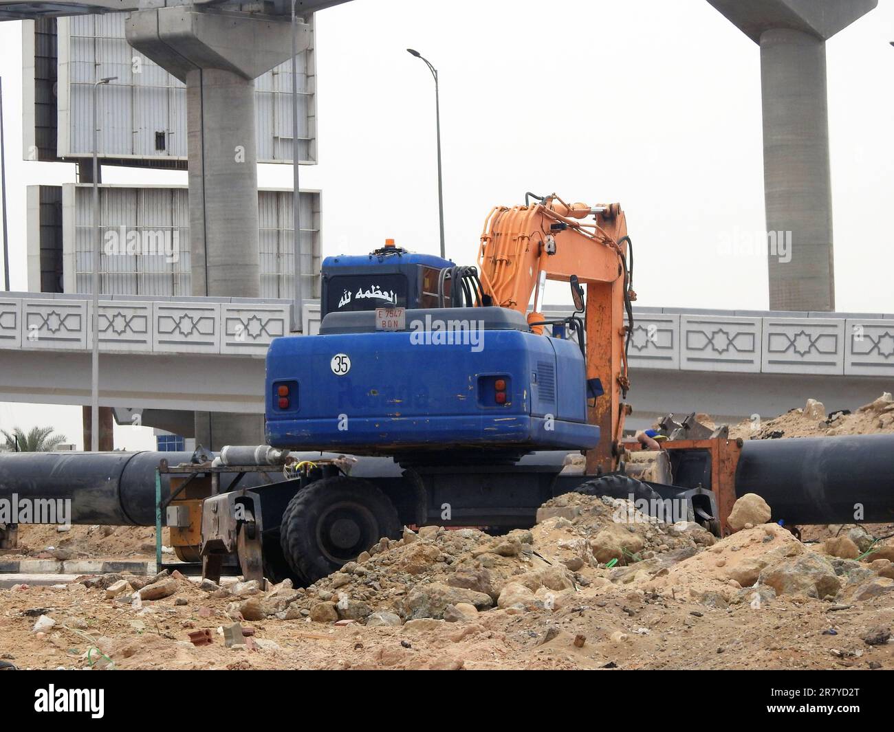 Cairo, Egypt, May 26 2023: preparations to place large water pipe parts ...