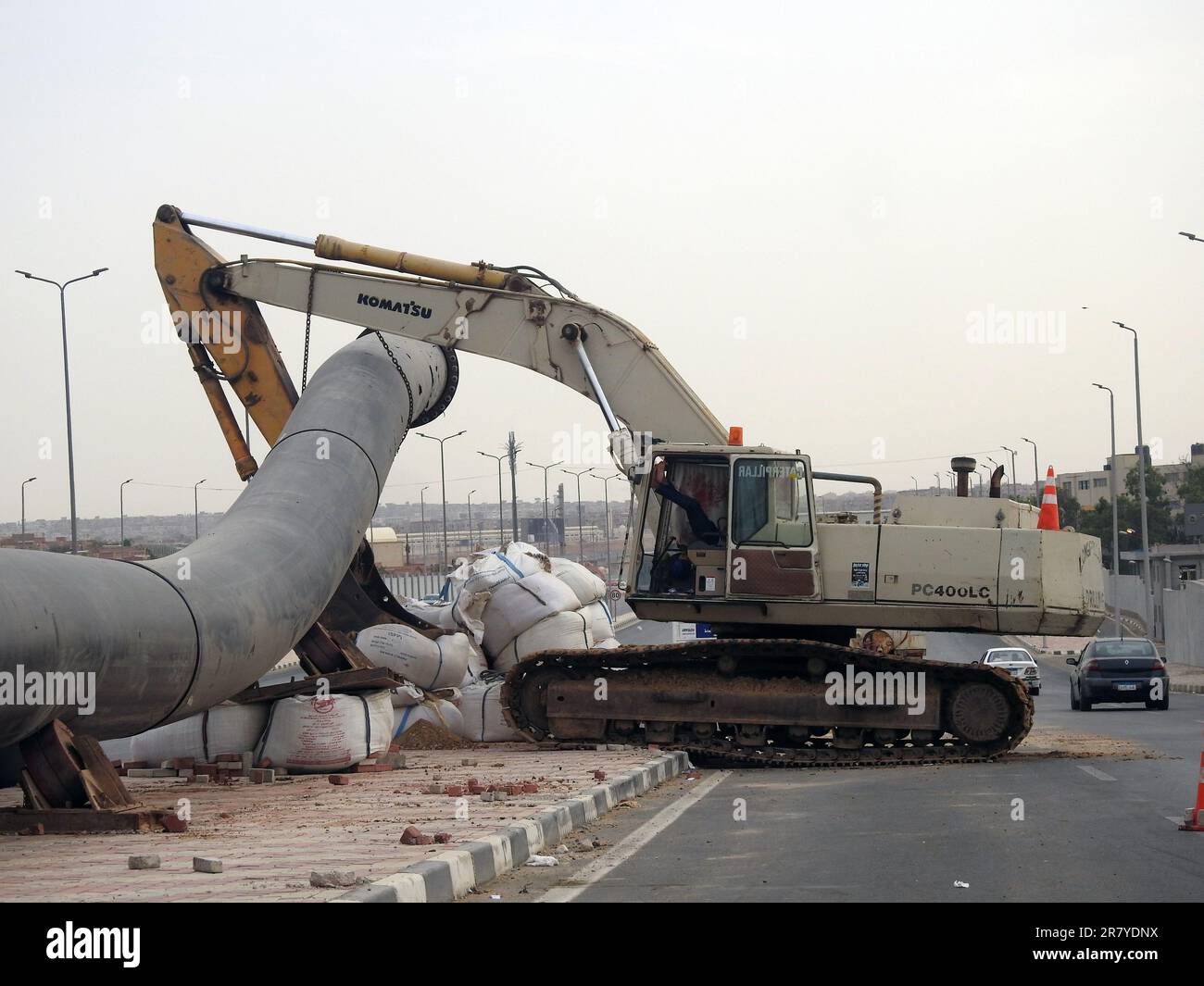 Cairo, Egypt, May 31 2023: preparations to place large water pipe parts ...