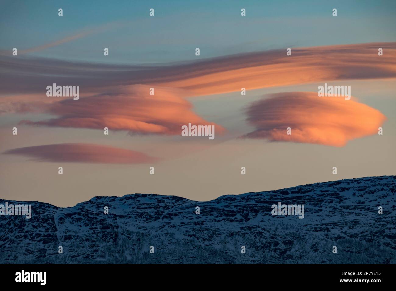 Lenticular clouds, Altocumulus lenticularis in winter in Norway, pink ...