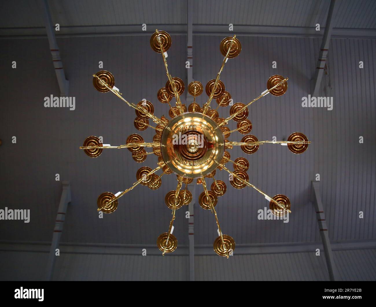 Unusual perspective under a magnificent chandelier in church Stock ...