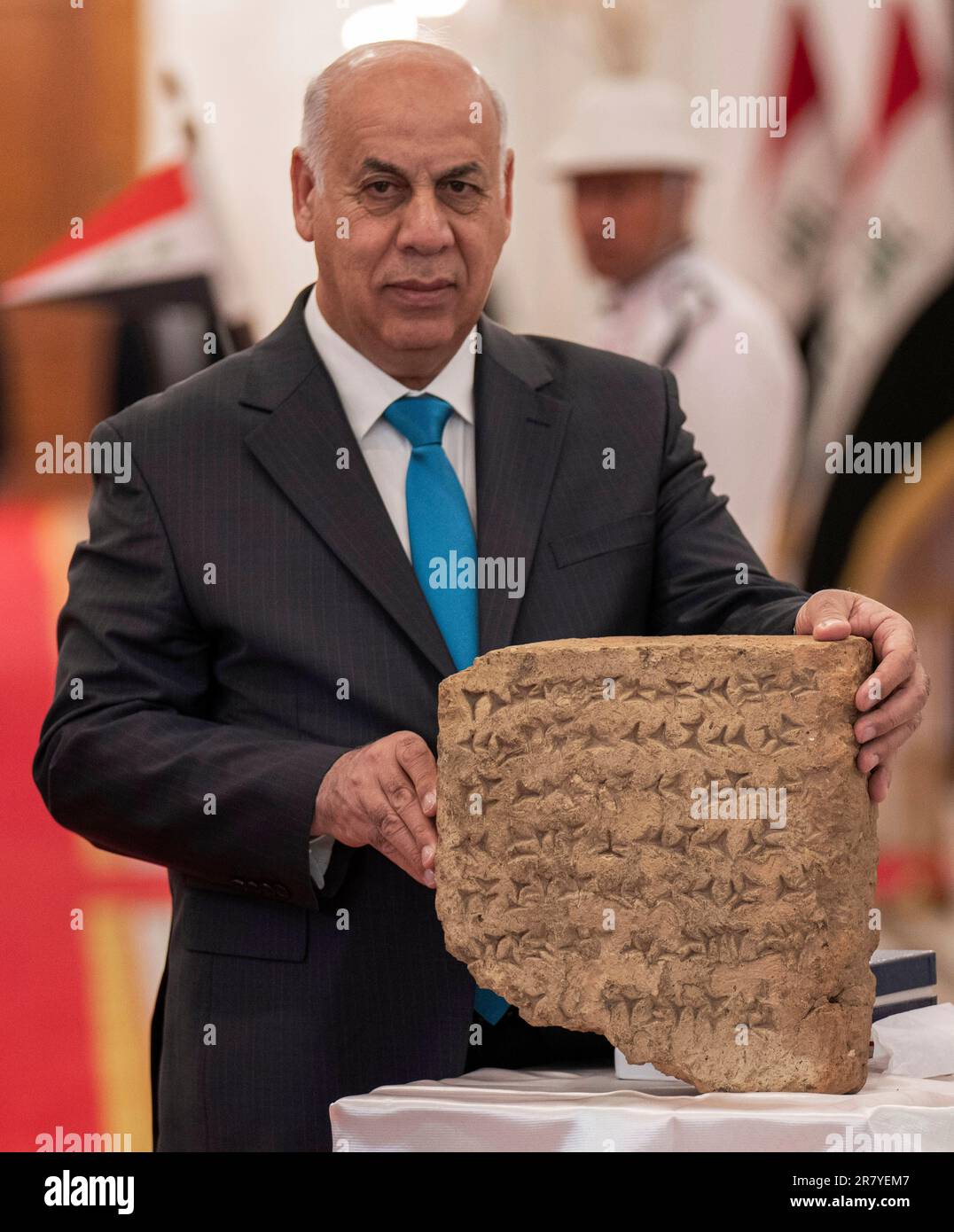 Iraqi Minister of Culture, Ahmed Fakak Al-Badrani displays an ancient ...