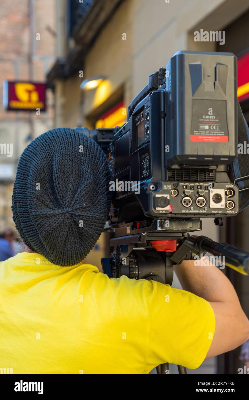 Cinematographer on the streets of San Sebastian for a television report ...