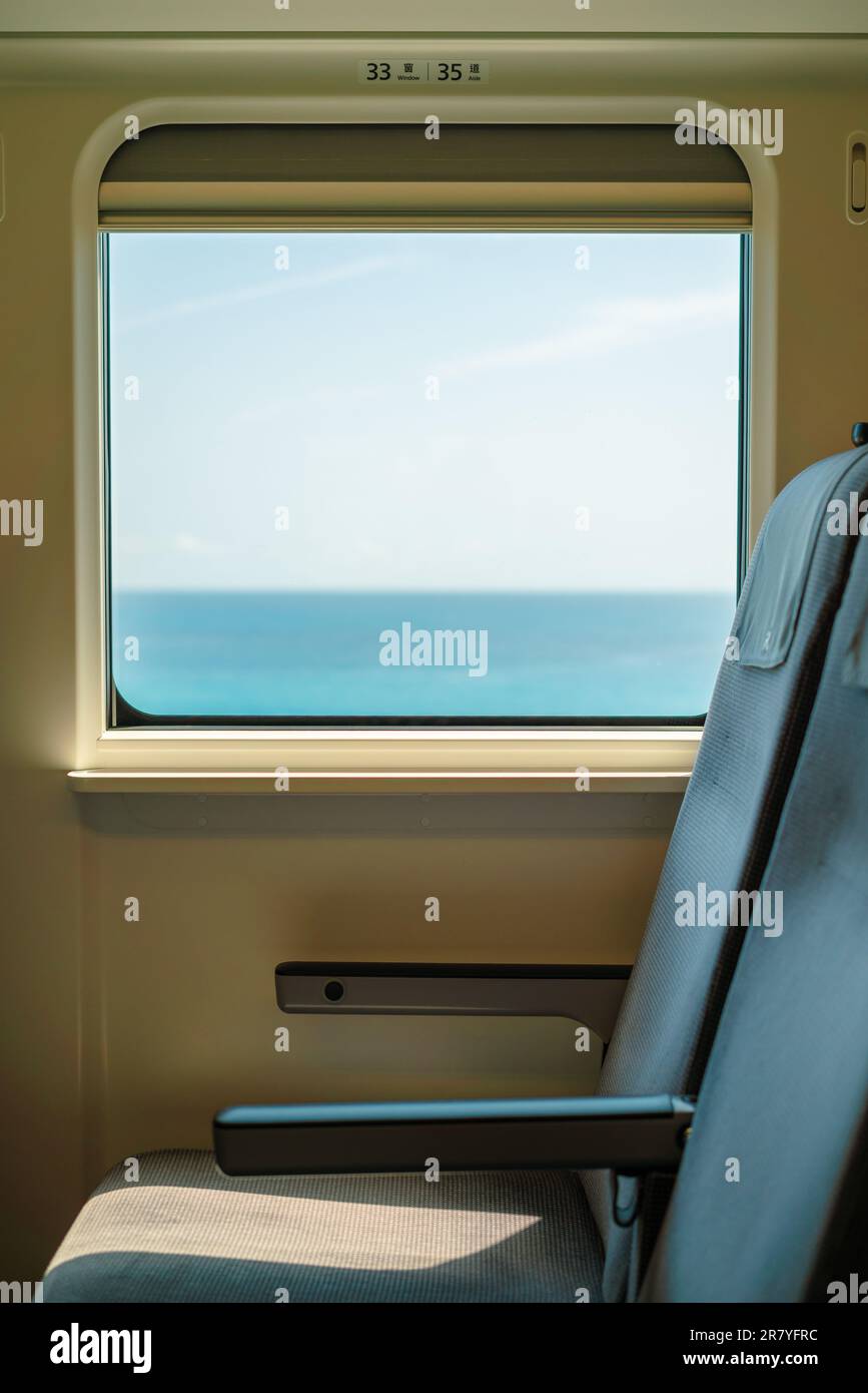 Inside of train and view of seascape from window in Taitung, Taiwan ...